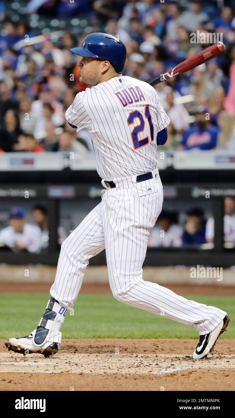 New York Mets' Lucas Duda (21) follows through on a two-run double ...