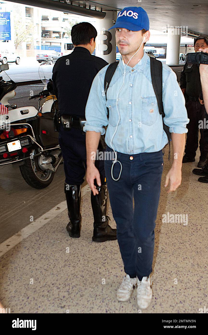 Wearing a Laos hat, "Transformers" star Shia Labeouf arrives at LAX and ...