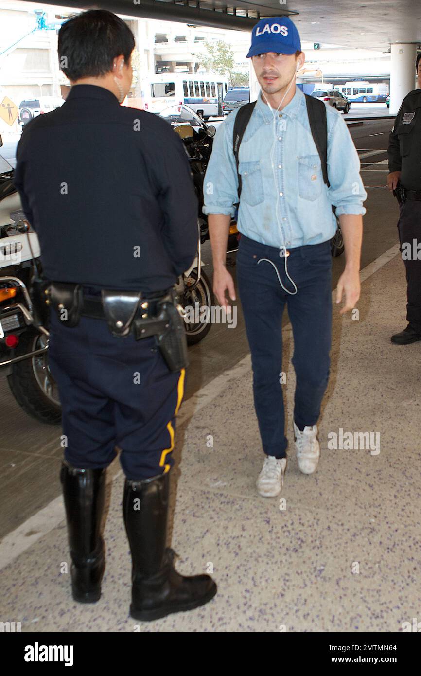 Wearing a Laos hat, "Transformers" star Shia Labeouf arrives at LAX and ...