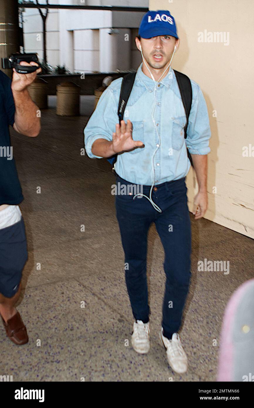 Wearing a Laos hat, "Transformers" star Shia Labeouf arrives at LAX and ...