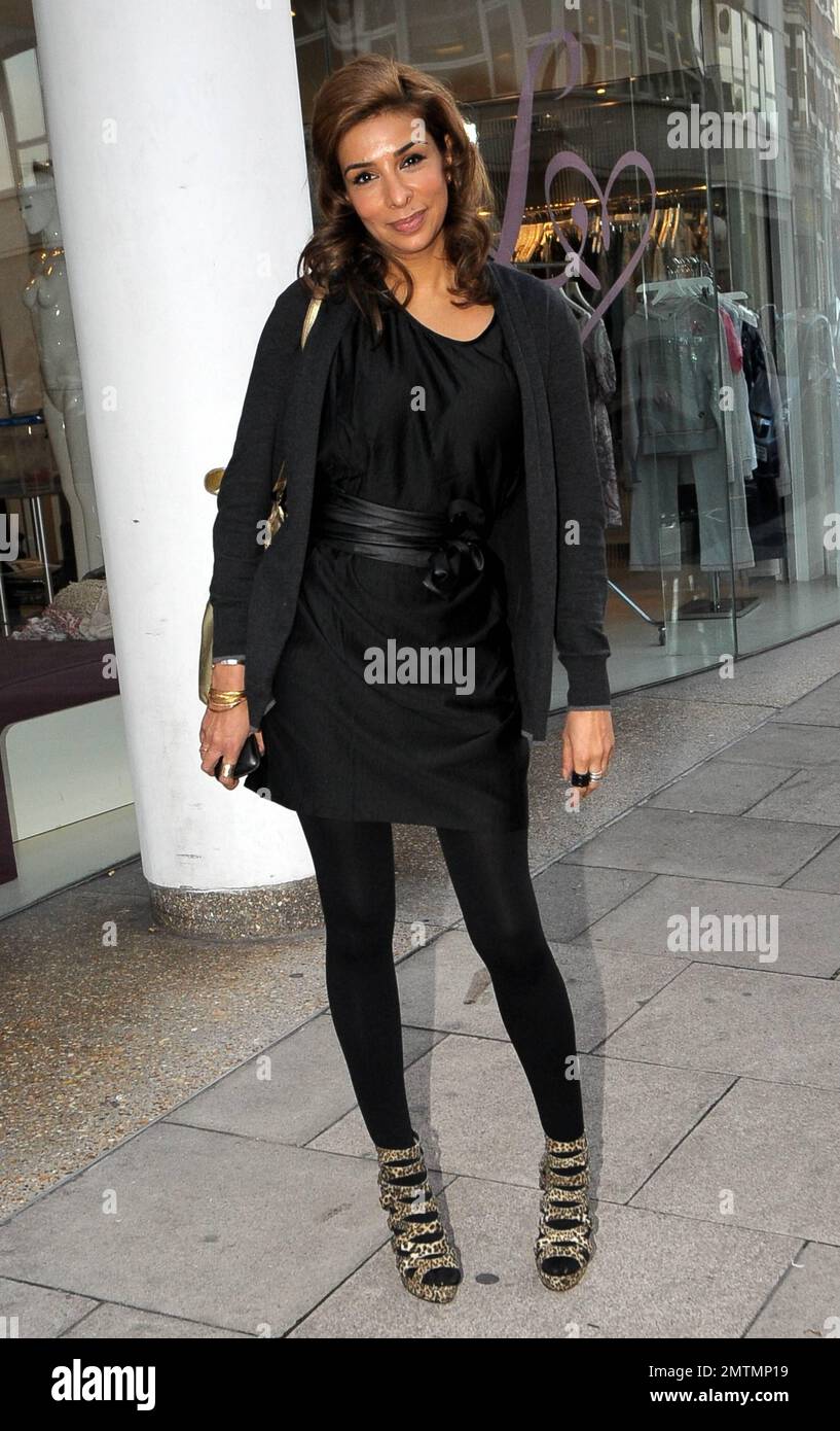 Wearing a black dress paired with some animal print heels, "Coronation ...