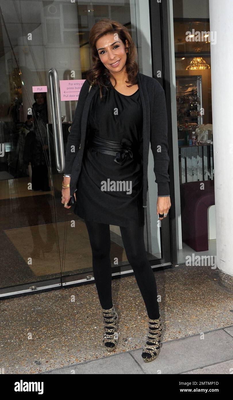 Wearing a black dress paired with some animal print heels, "Coronation ...