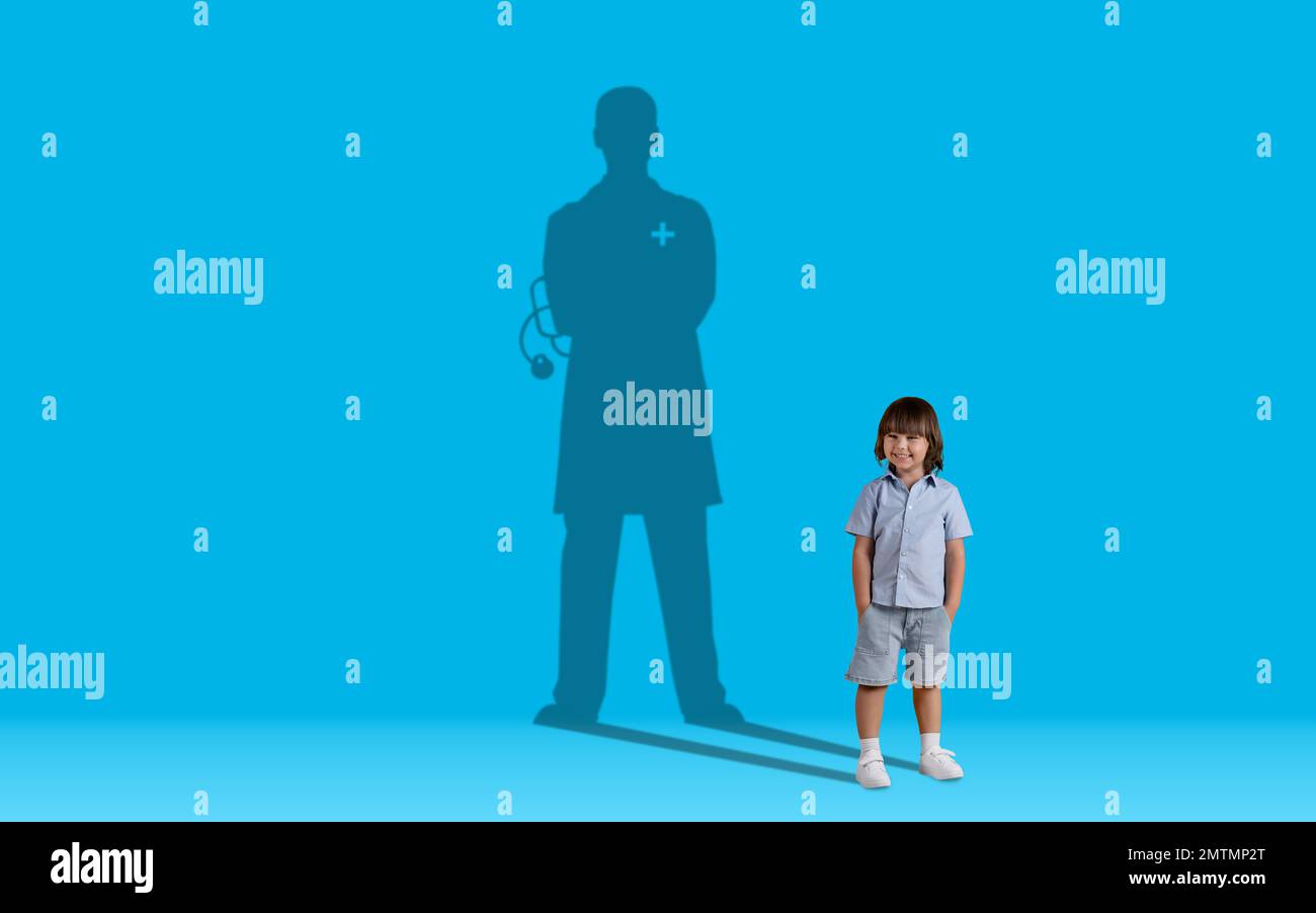 Cute little boy dreaming to become a doctor Stock Photo - Alamy