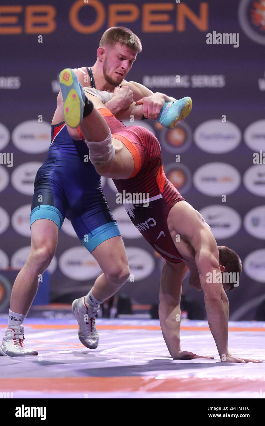ZAGREB, CROATIA – FEBRUARY 01: Patrik Leder of Canada (red) competes ...