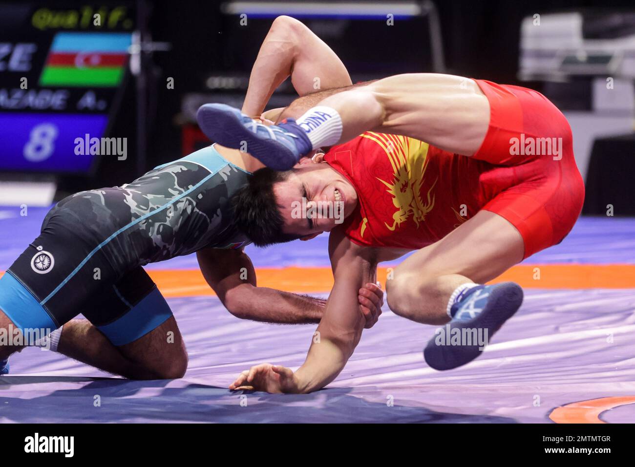ZAGREB, CROATIA – FEBRUARY 01: Weiyu Li of China (red) competes against ...