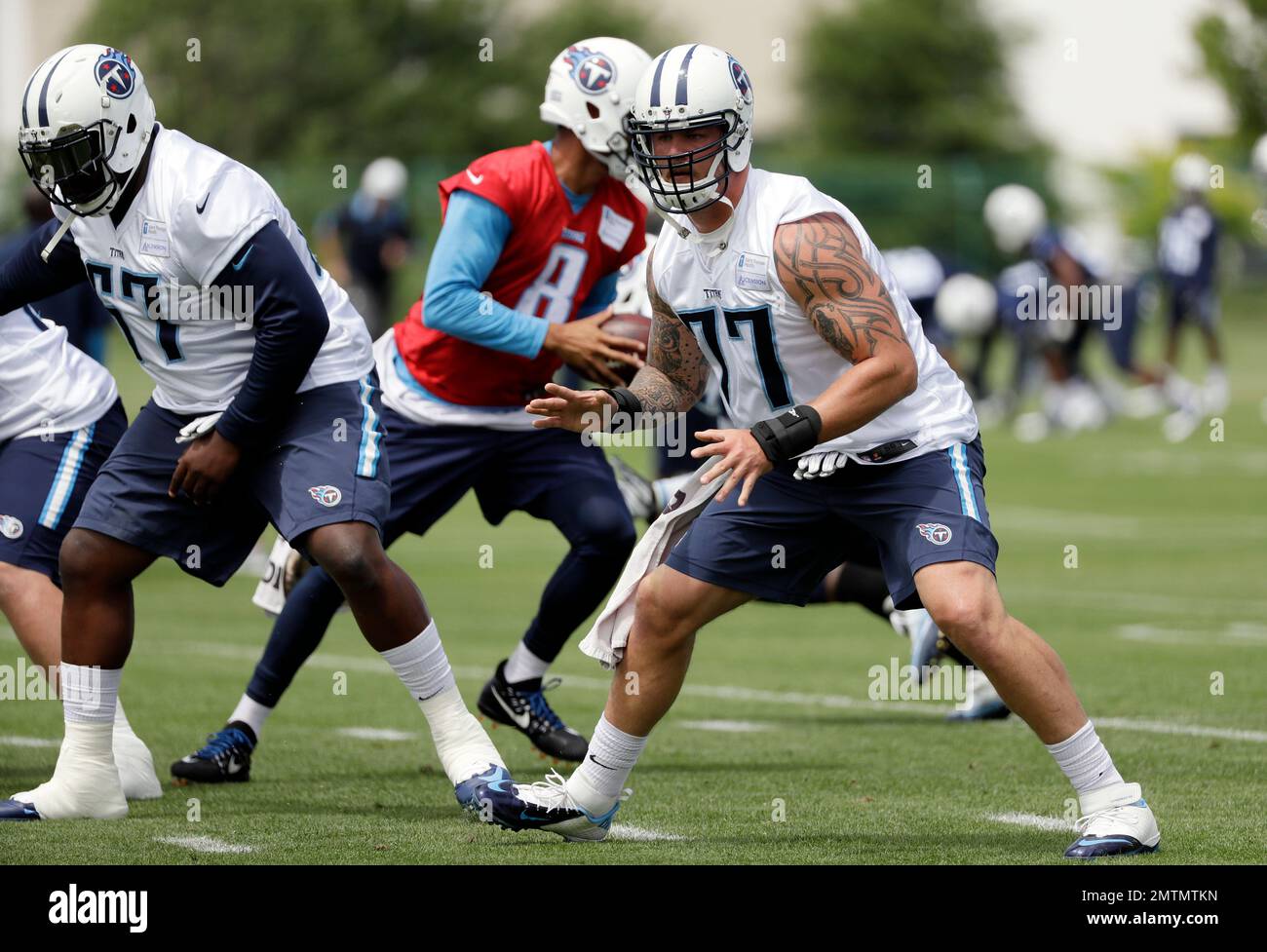 Tennessee Titans tackle Taylor Lewan (77) runs a drill during the team ...
