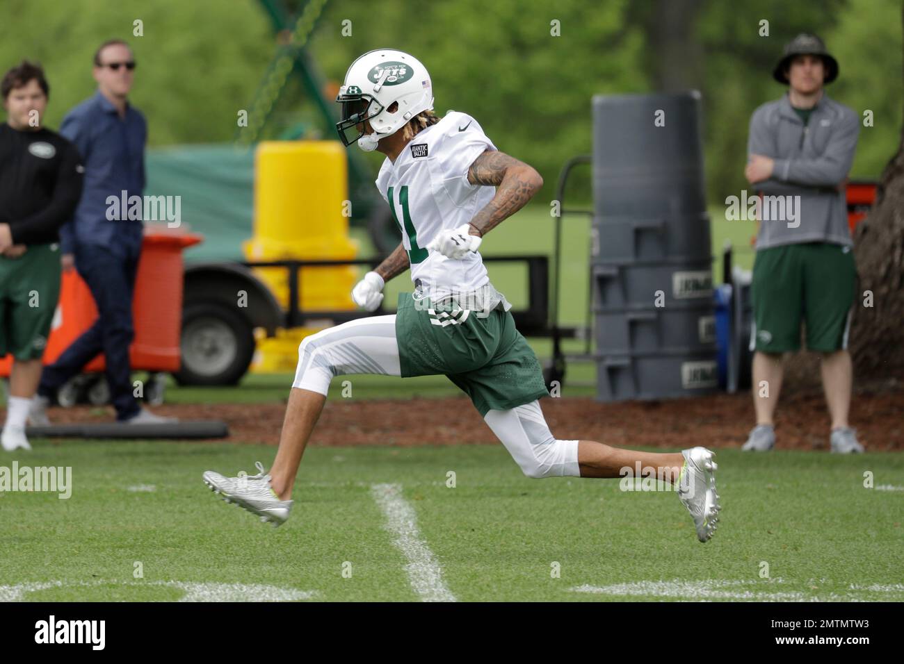 New York Jets' Robby Anderson runs a drill during the team's organized ...