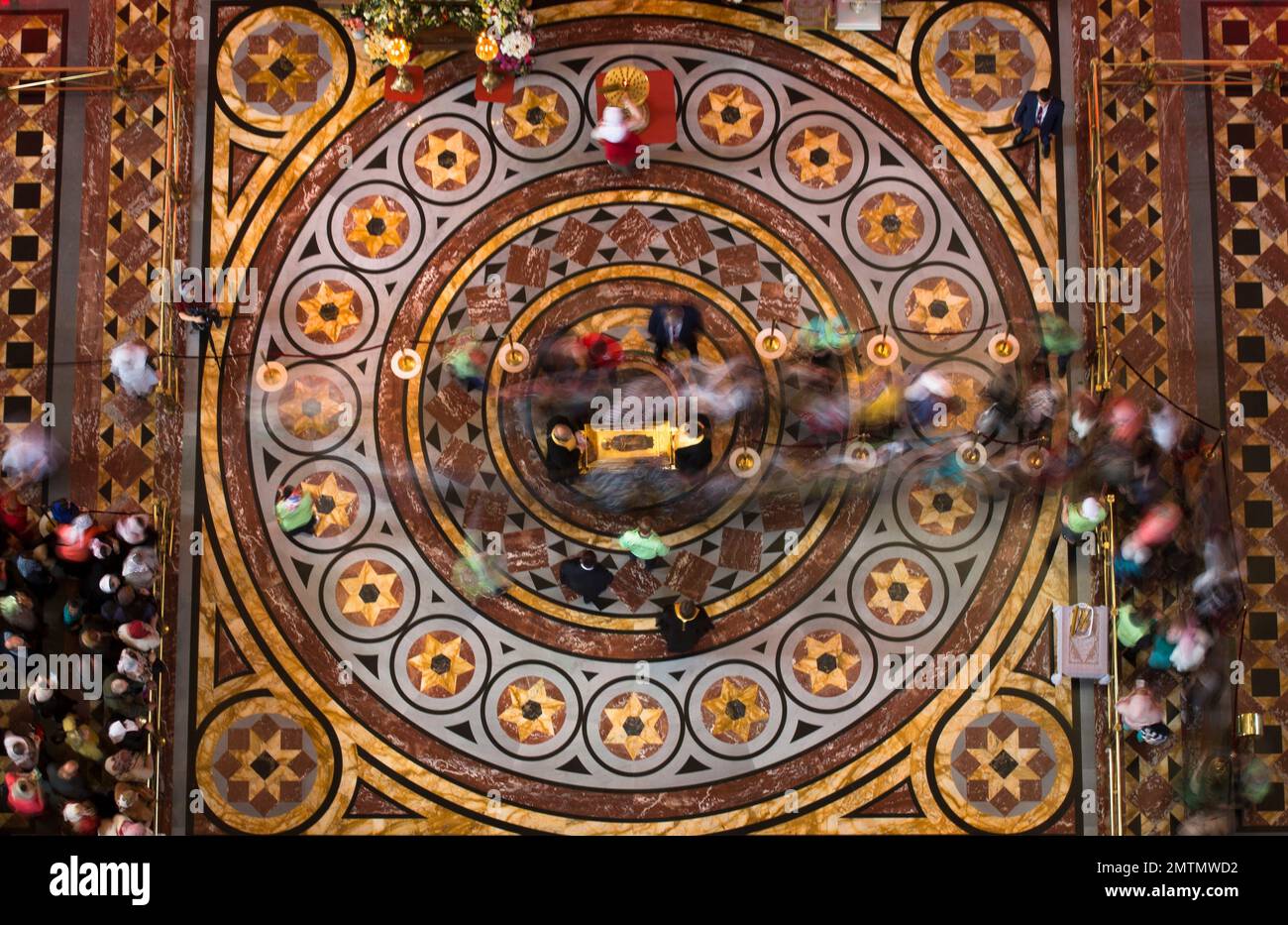 Russian Orthodox believers line up to kiss the relics of Saint Nicholas ...