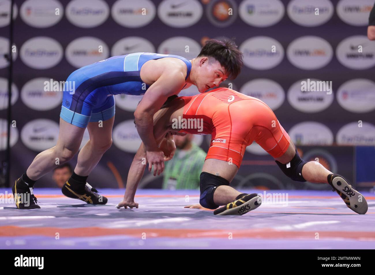ZAGREB, CROATIA – FEBRUARY 01: Kaiji Ogino of Japan (red) competes ...