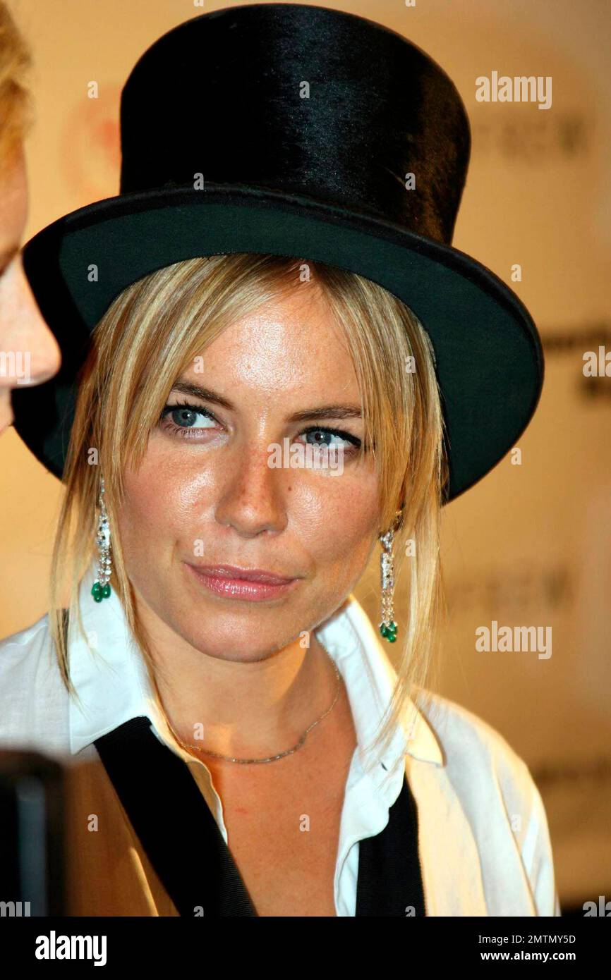 Top hatted Sienna Miller and sister Savannah at the launch of their ...
