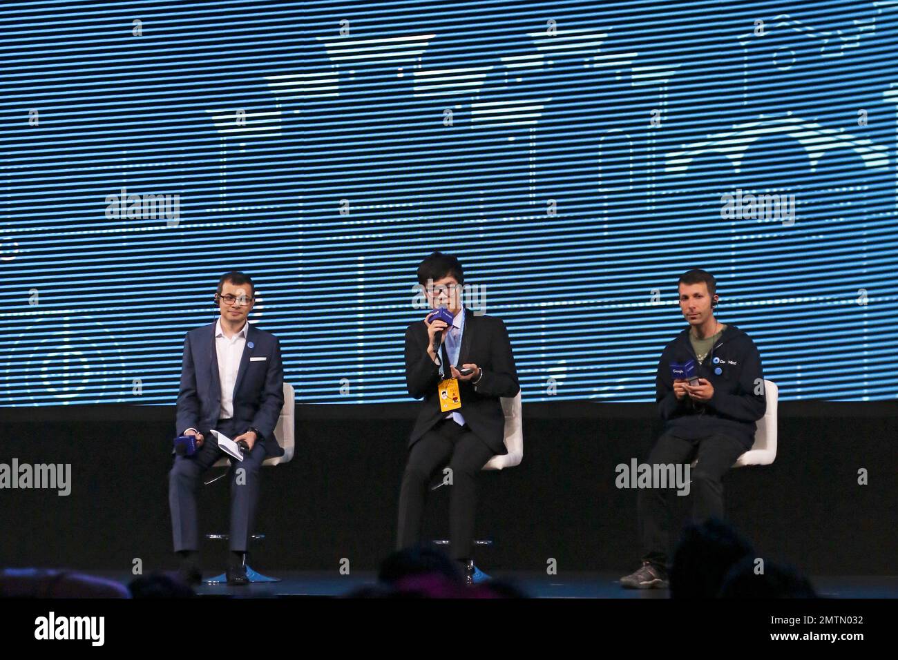 Go player Ke Jie, center, speaks at a press conference after playing a ...
