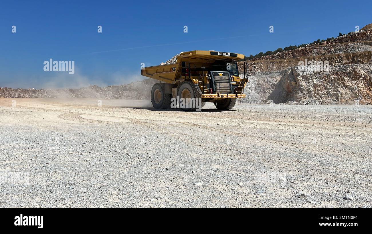 Huge dumper working at a limestone quarry Stock Photo - Alamy
