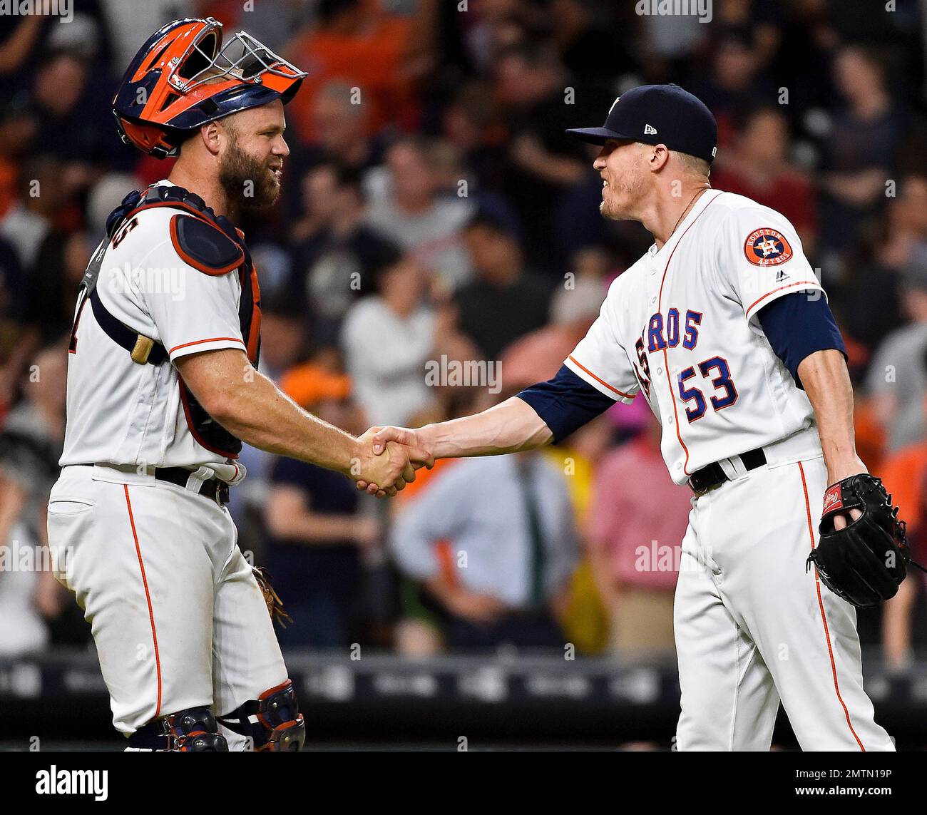 Houston Astros relief pitcher Ken Giles (53) shakes hands with catcher ...