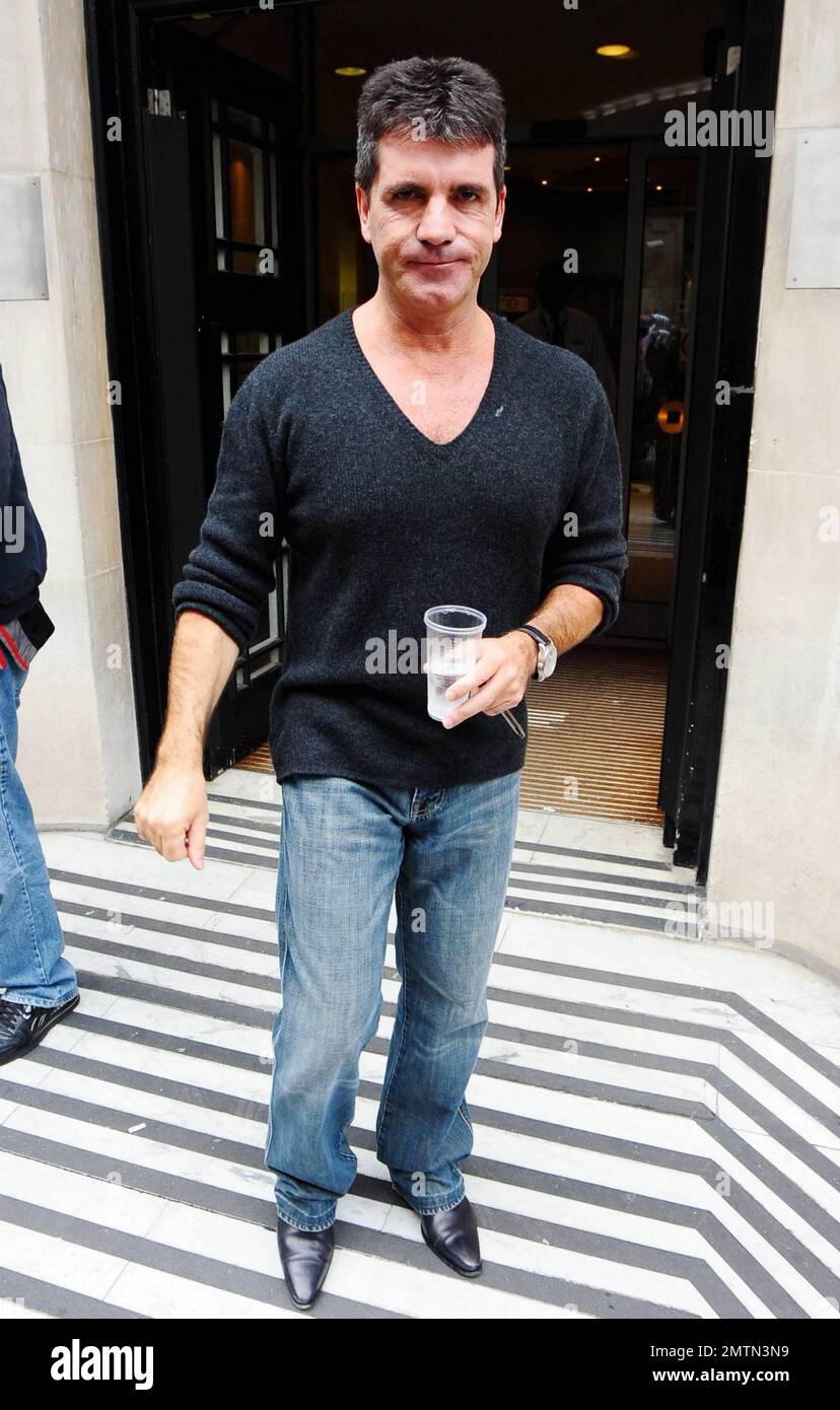 Former "American Idol" judge Simon Cowell arrives in a chauffeur-driven ...