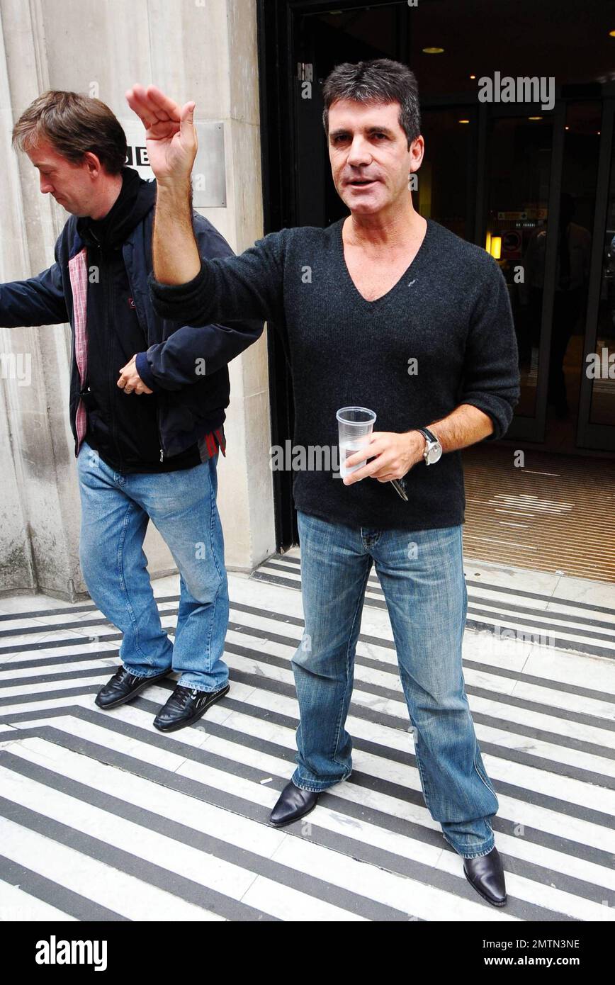 Former "American Idol" judge Simon Cowell arrives in a chauffeur-driven ...