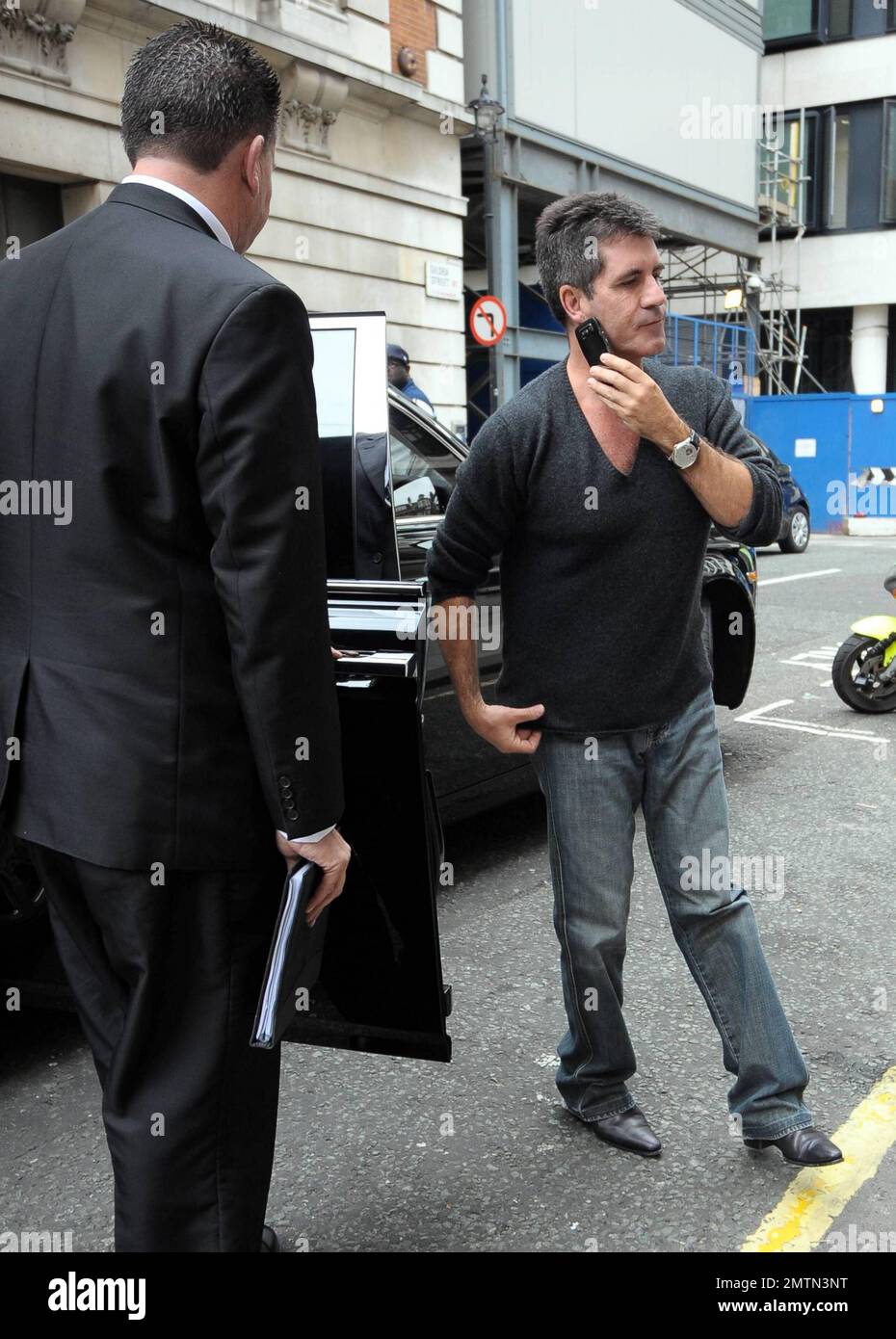 Former "American Idol" judge Simon Cowell arrives in a chauffeur-driven ...