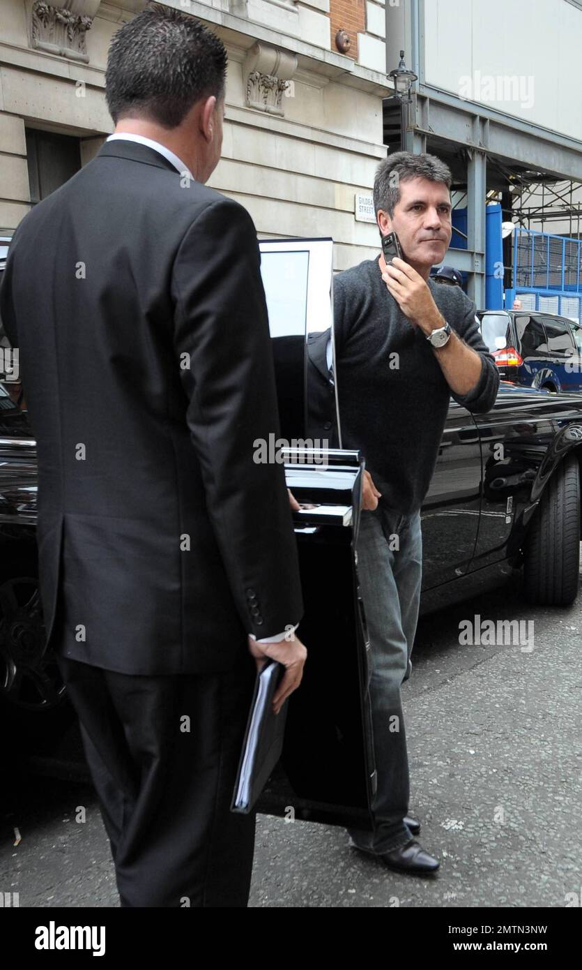 Former "American Idol" judge Simon Cowell arrives in a chauffeur-driven ...