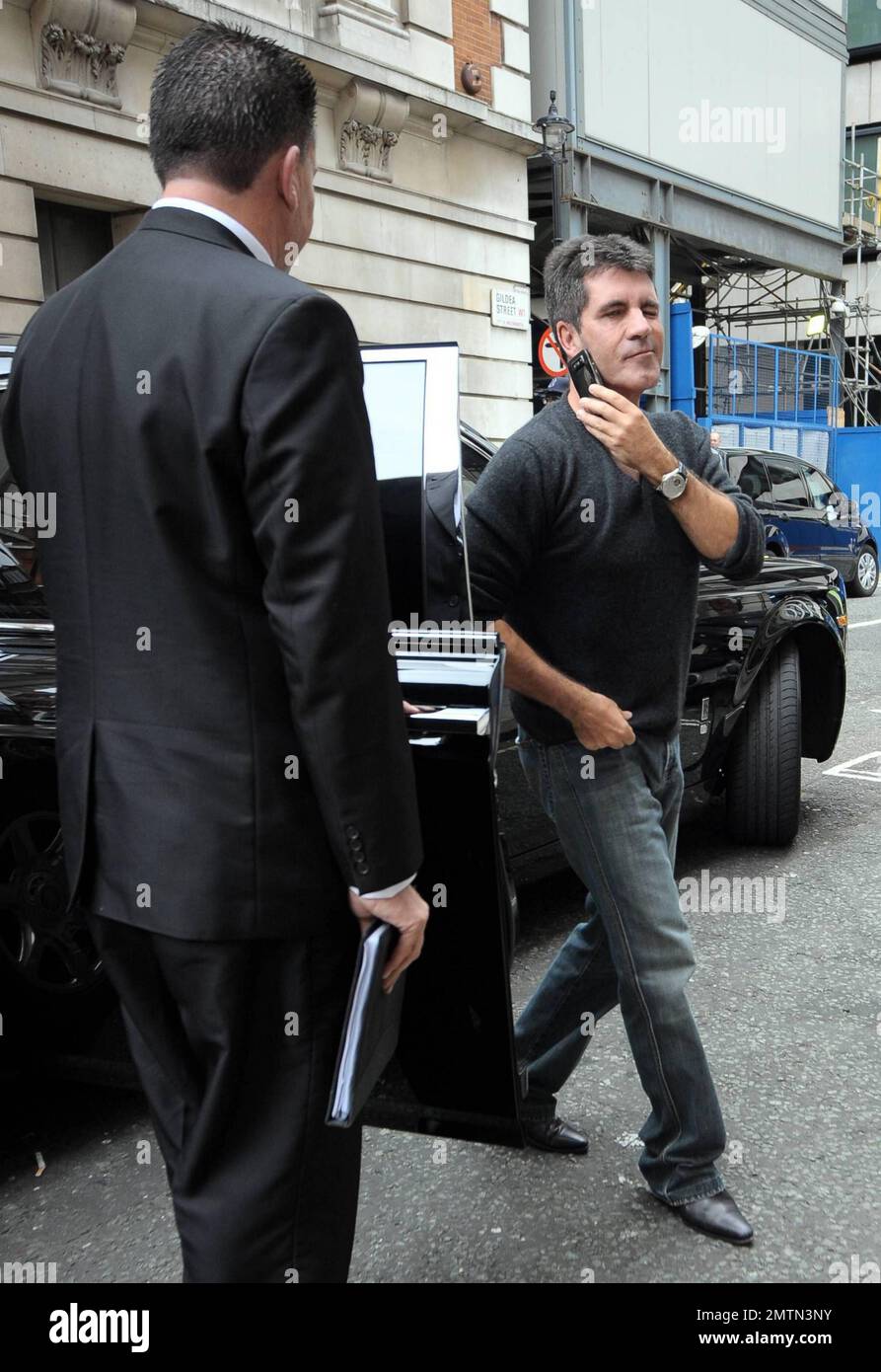 Former "American Idol" judge Simon Cowell arrives in a chauffeur-driven ...