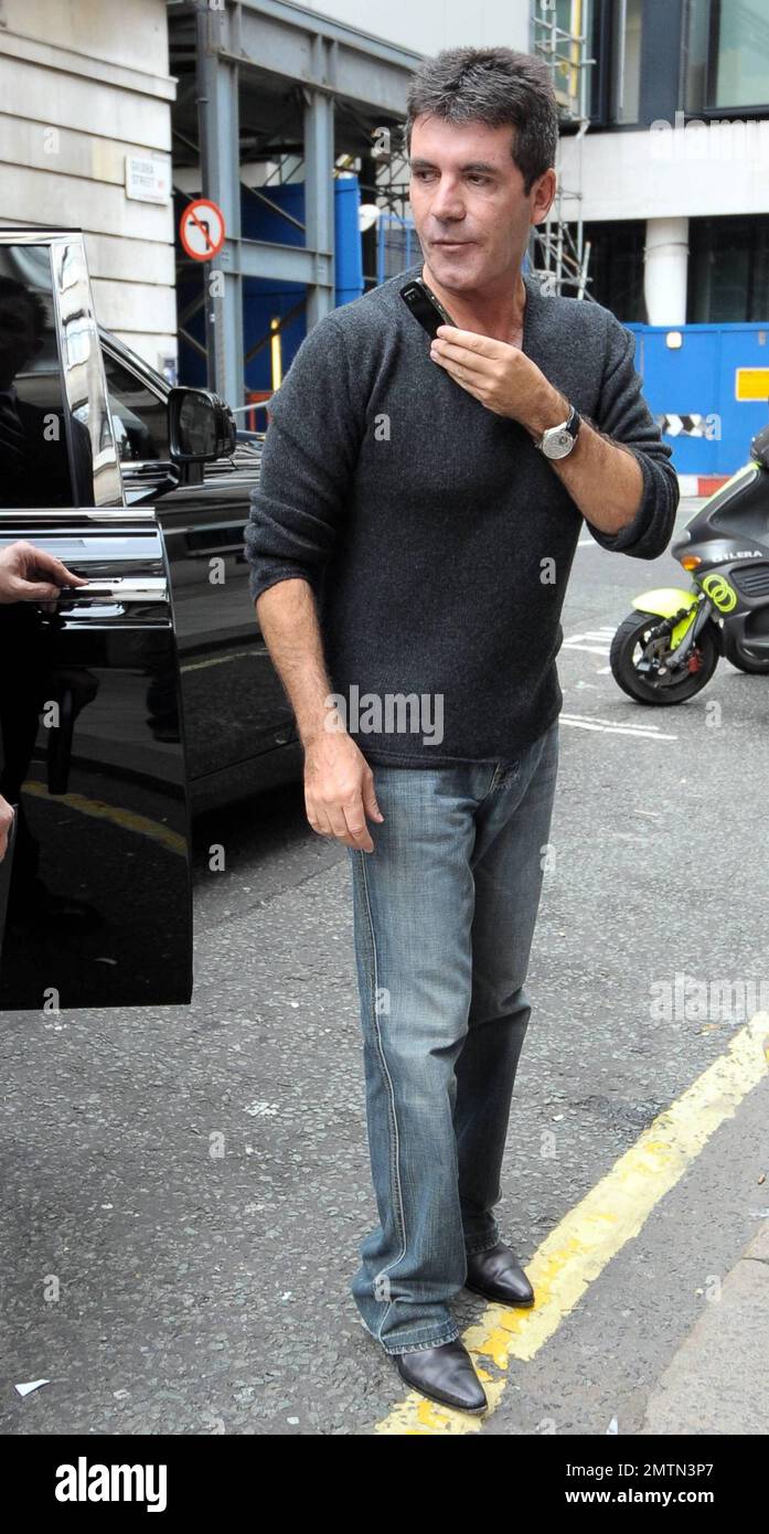 Former "American Idol" judge Simon Cowell arrives in a chauffeur-driven ...