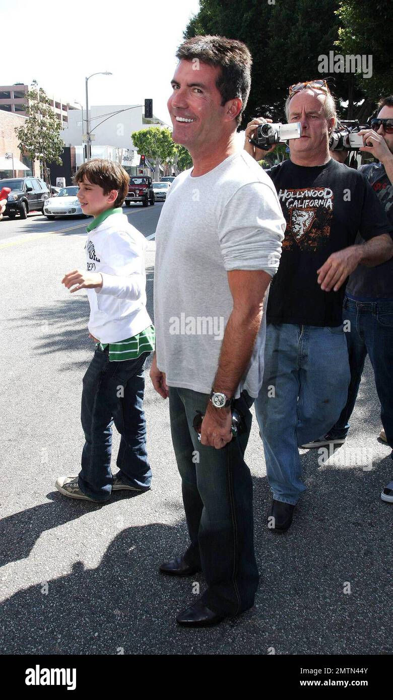 Simon Cowell is an American Idol. His fans crowded around him today as ...