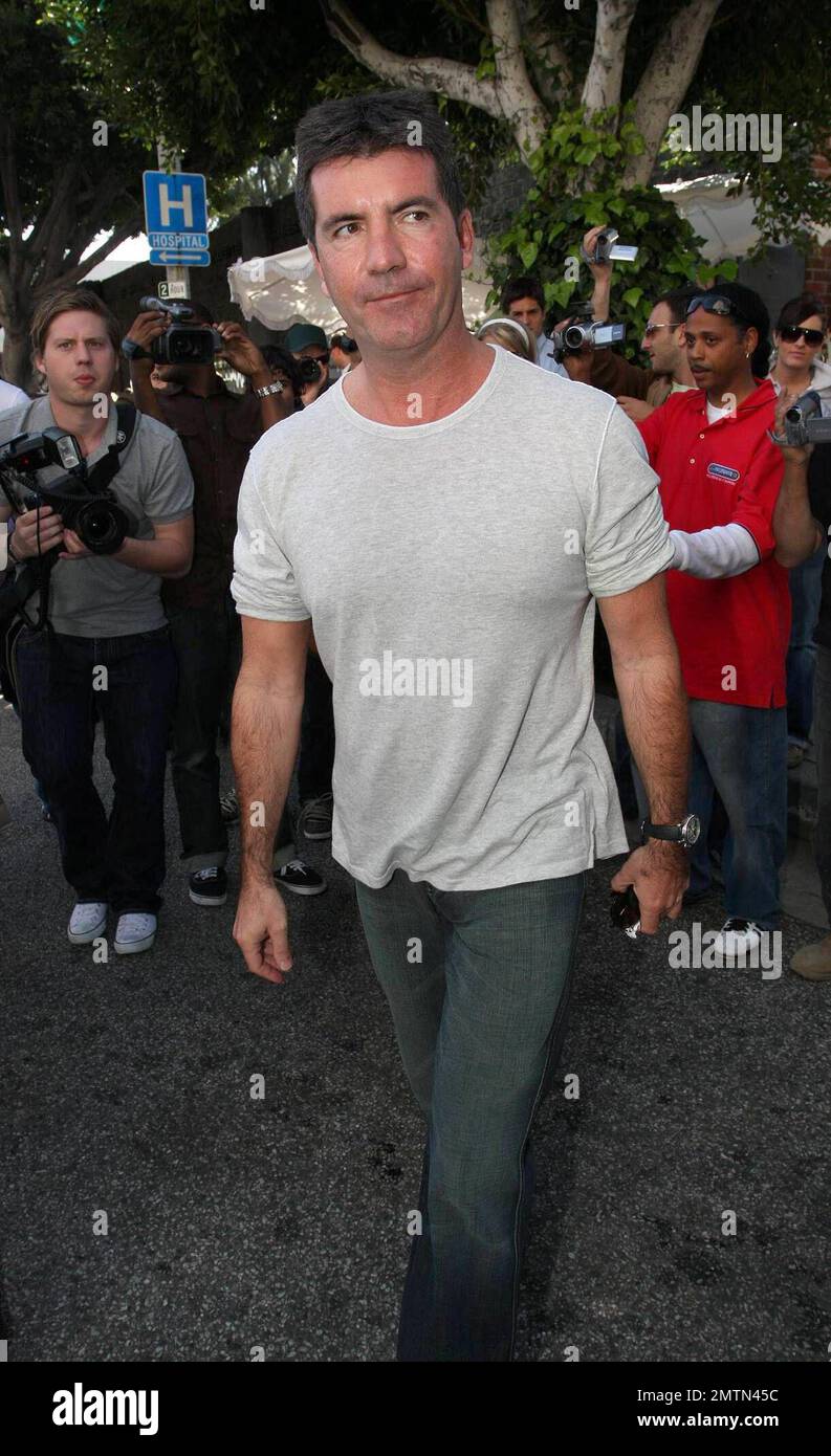 Simon Cowell is an American Idol. His fans crowded around him today as ...