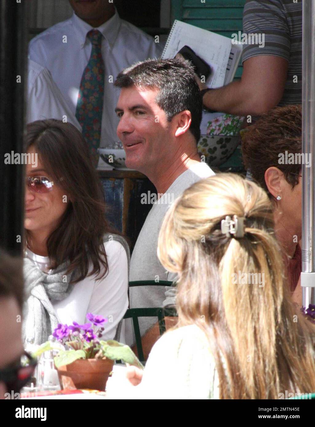 Simon Cowell is an American Idol. His fans crowded around him today as ...