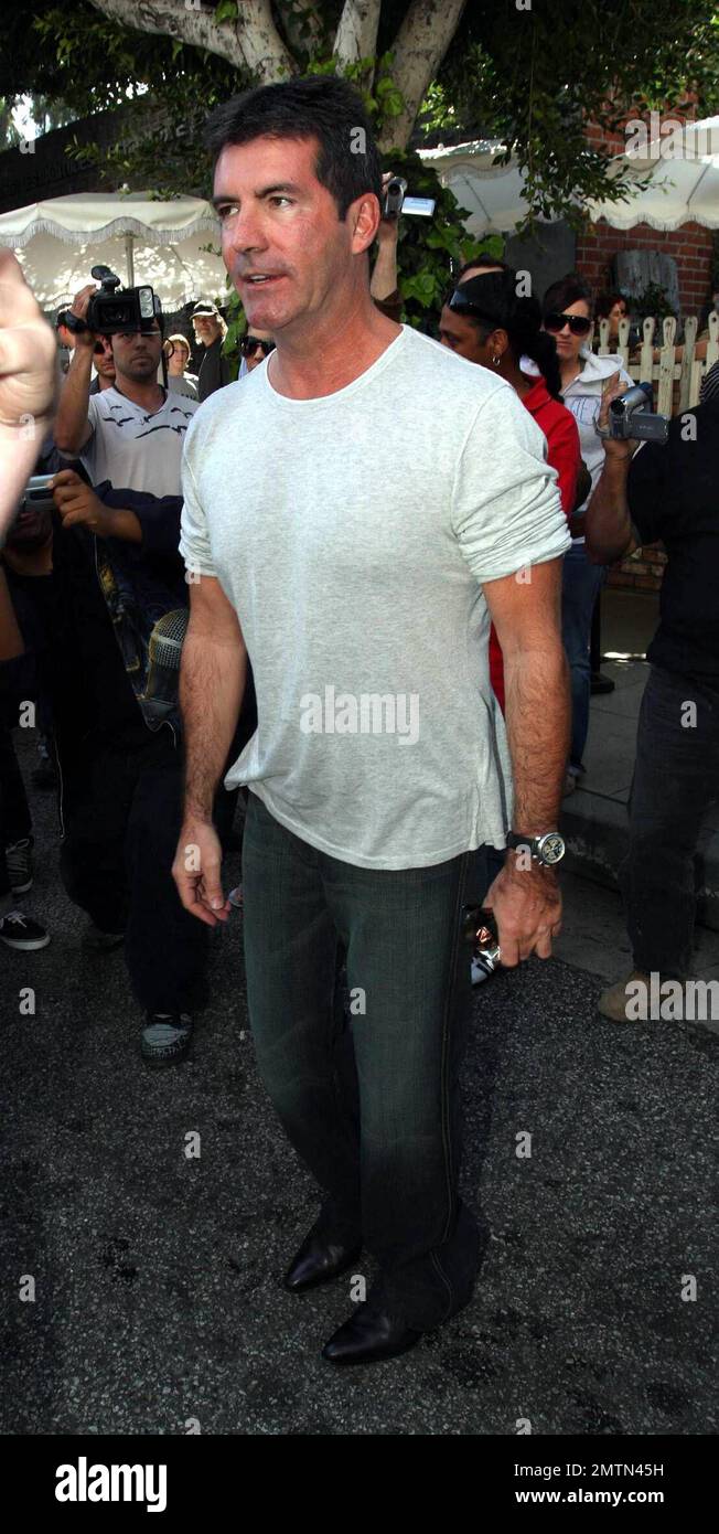 Simon Cowell is an American Idol. His fans crowded around him today as ...