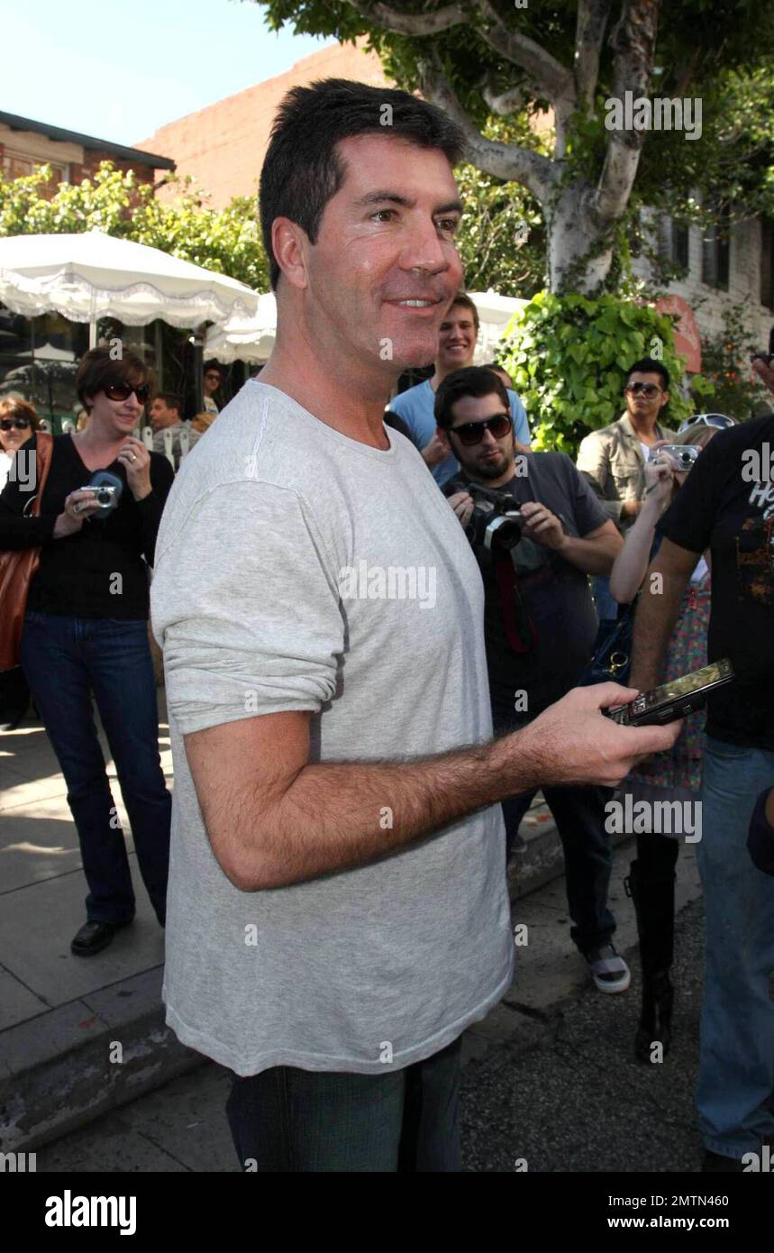 Simon Cowell is an American Idol. His fans crowded around him today as ...