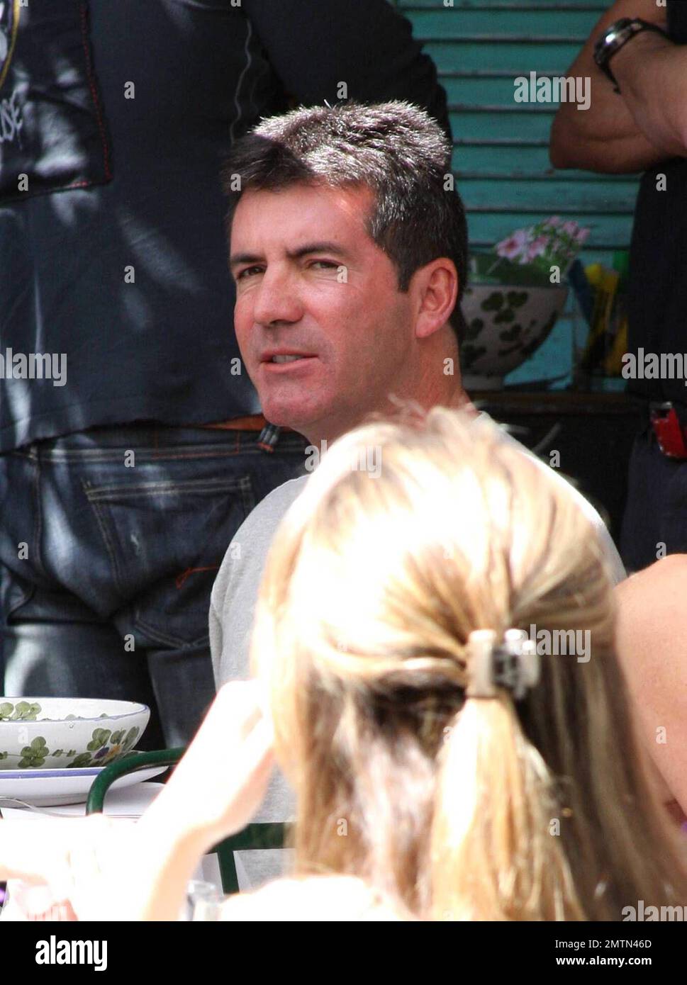 Simon Cowell is an American Idol. His fans crowded around him today as ...