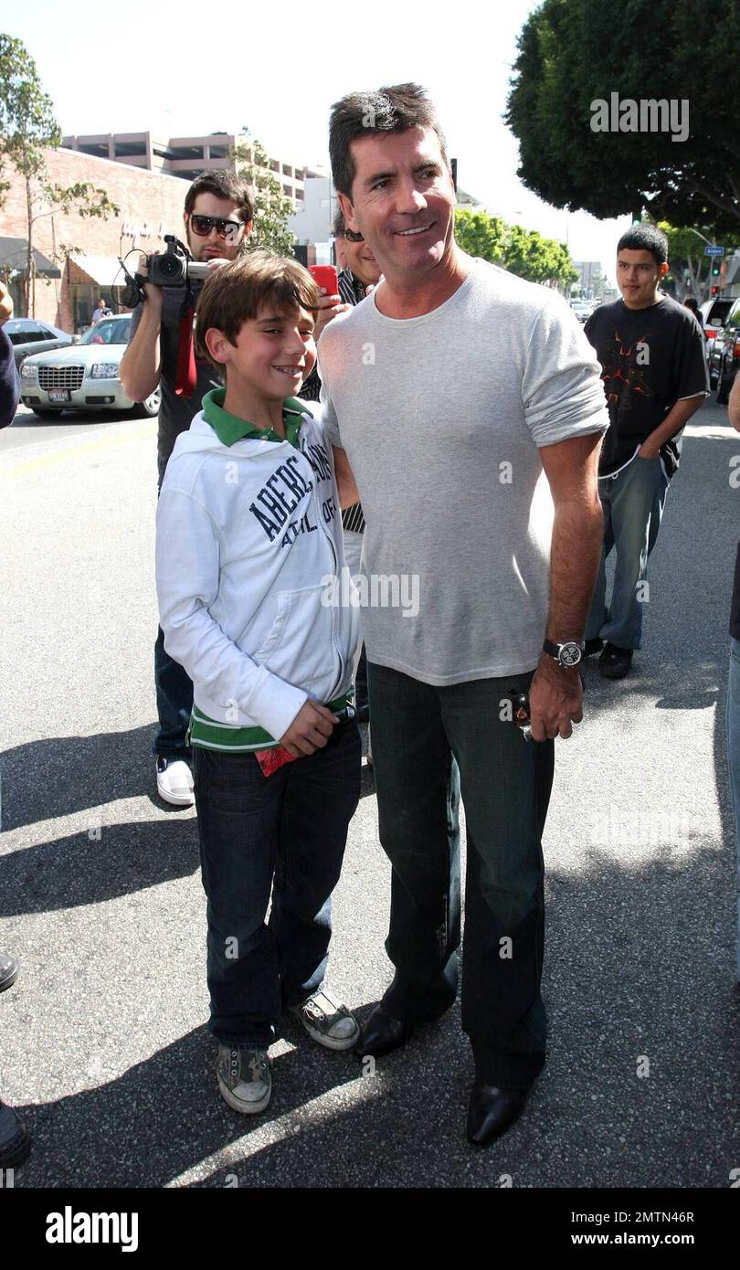 Simon Cowell is an American Idol. His fans crowded around him today as ...