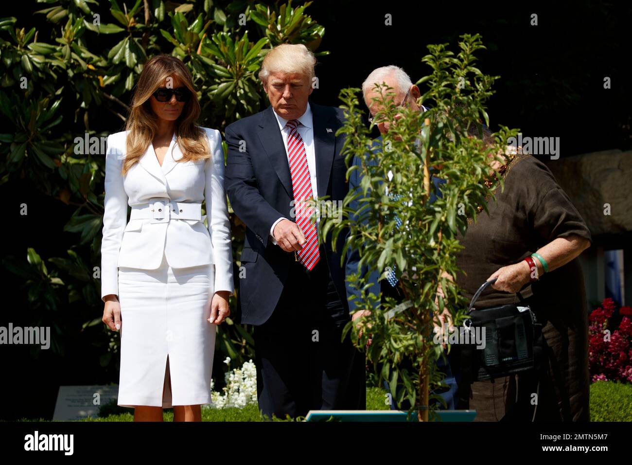 President Donald Trump and first lady Melania Trump take part in a tree planting with Israeli ...