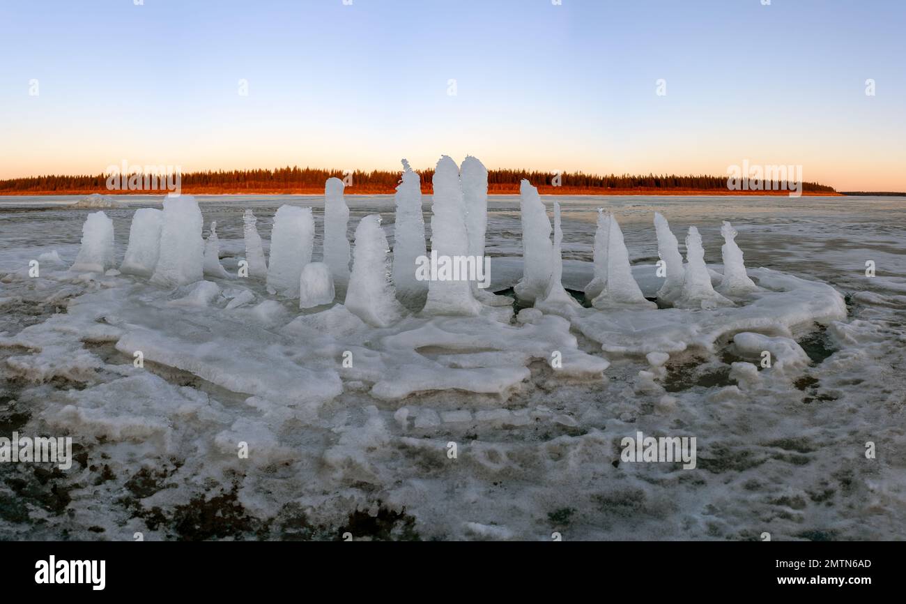 A panorama of abandoned and melting cut ice with pillars for defrosting ...