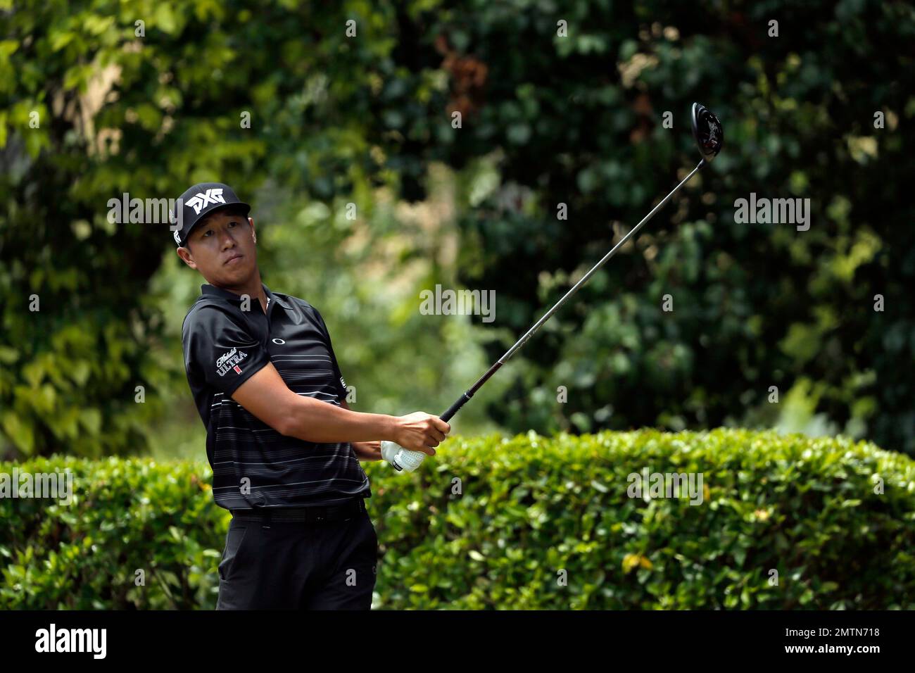 James Hahn watches his shot off the first tee during the final round of ...