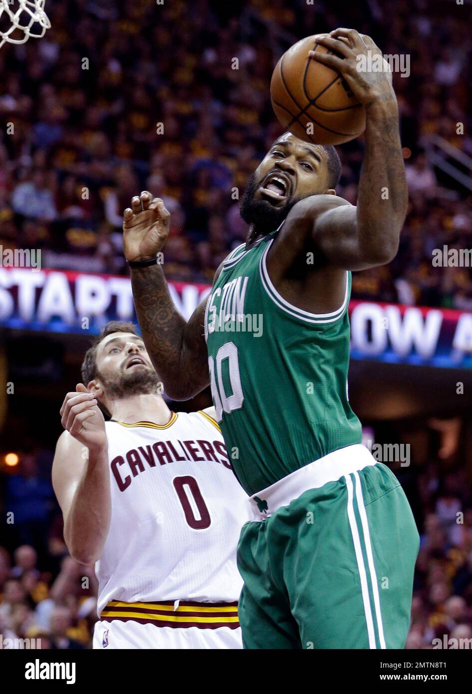 Boston Celtics' Amir Johnson (90) grabs a rebound against Cleveland ...