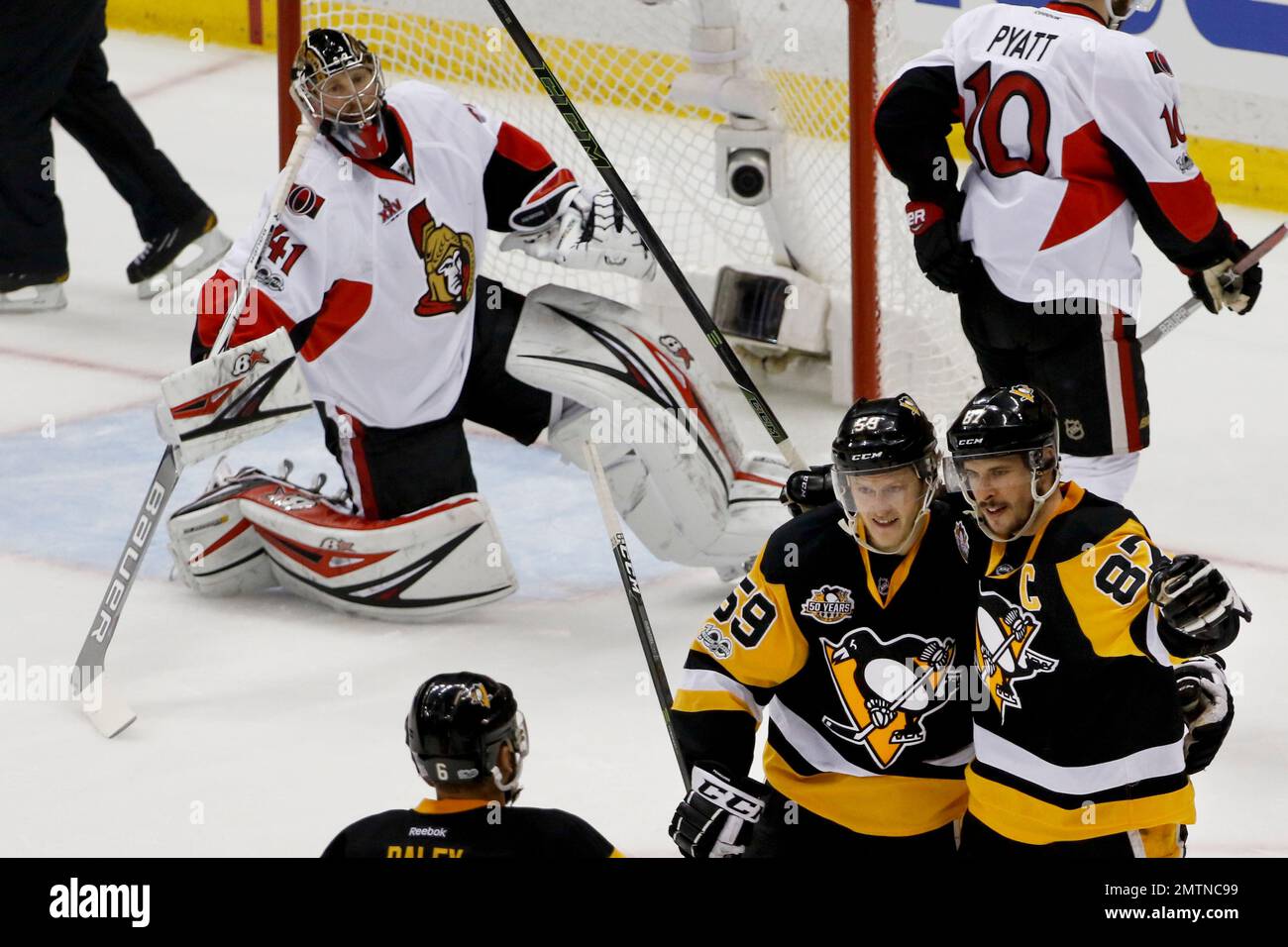 Pittsburgh Penguins' Sidney Crosby (87) celebrates with Jake Guentzel ...