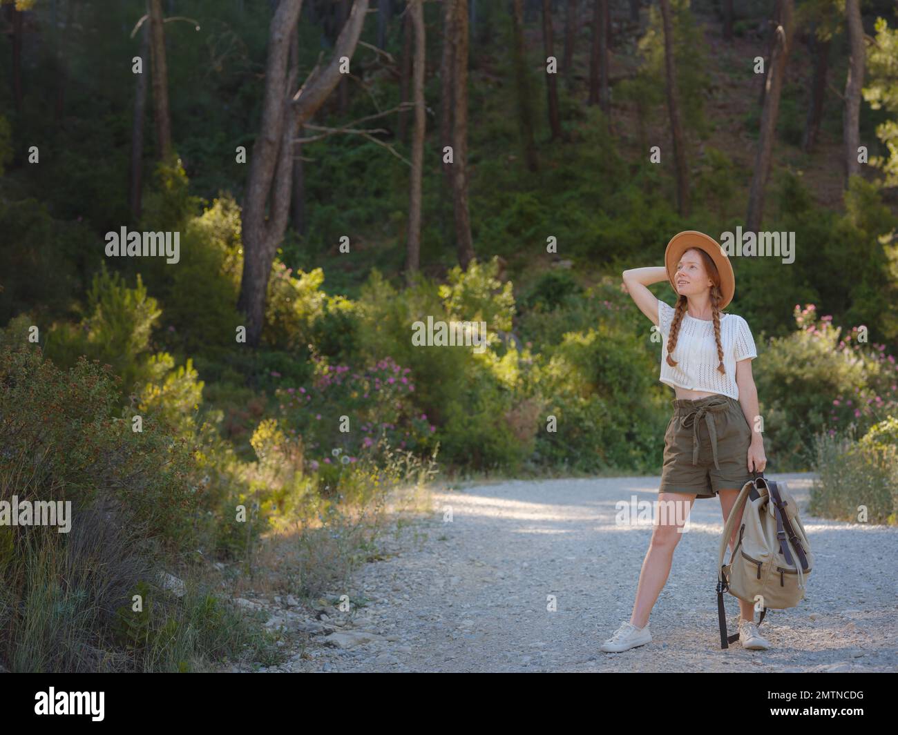 Caucasian ginger young beautiful female backpacker traveling alone in ...