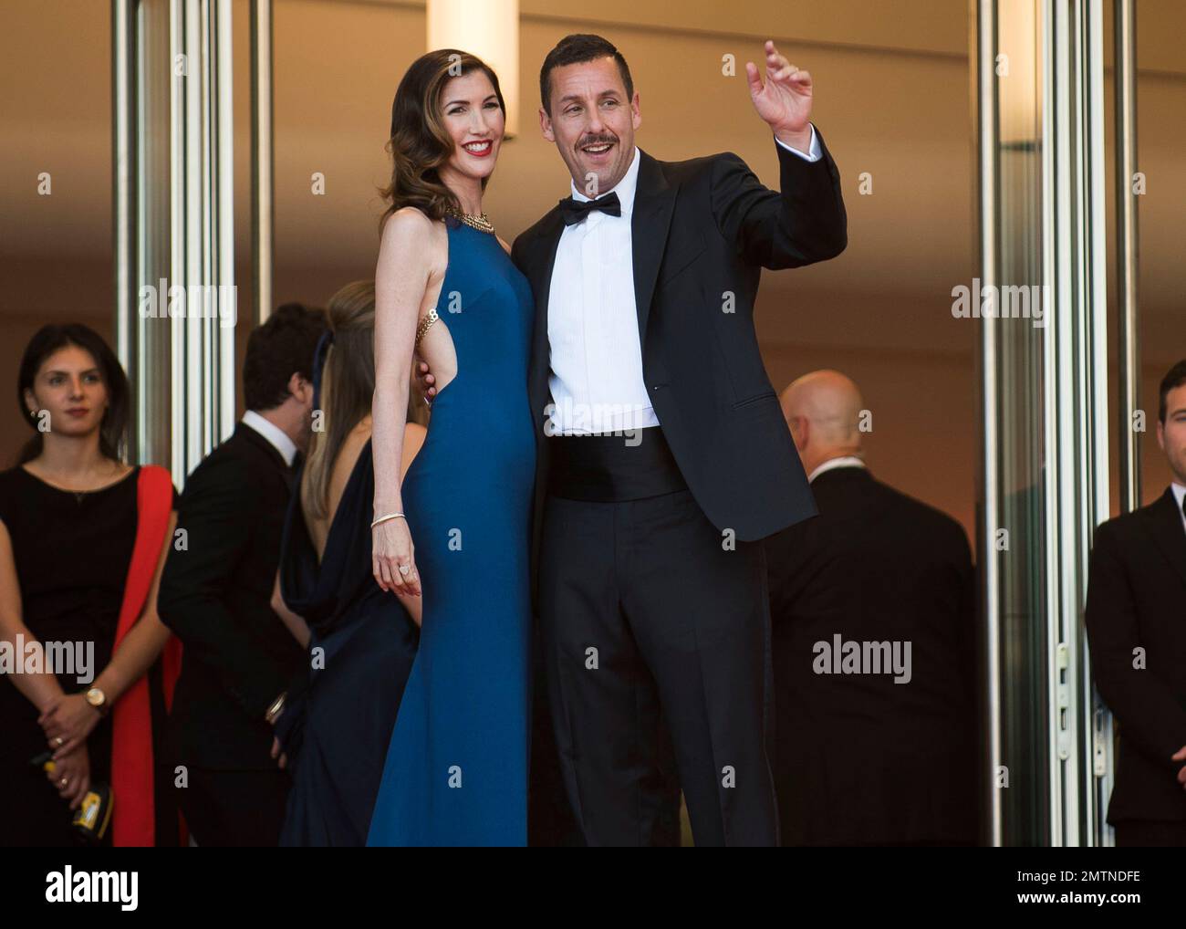 Adam Sandler, right, and his wife Jackie Sandler pose for photographers ...
