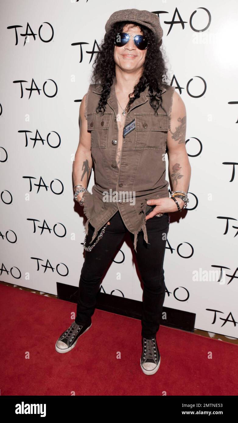 Legendary musician Slash (aka Saul Hudson) shows off his tattoos in a ...
