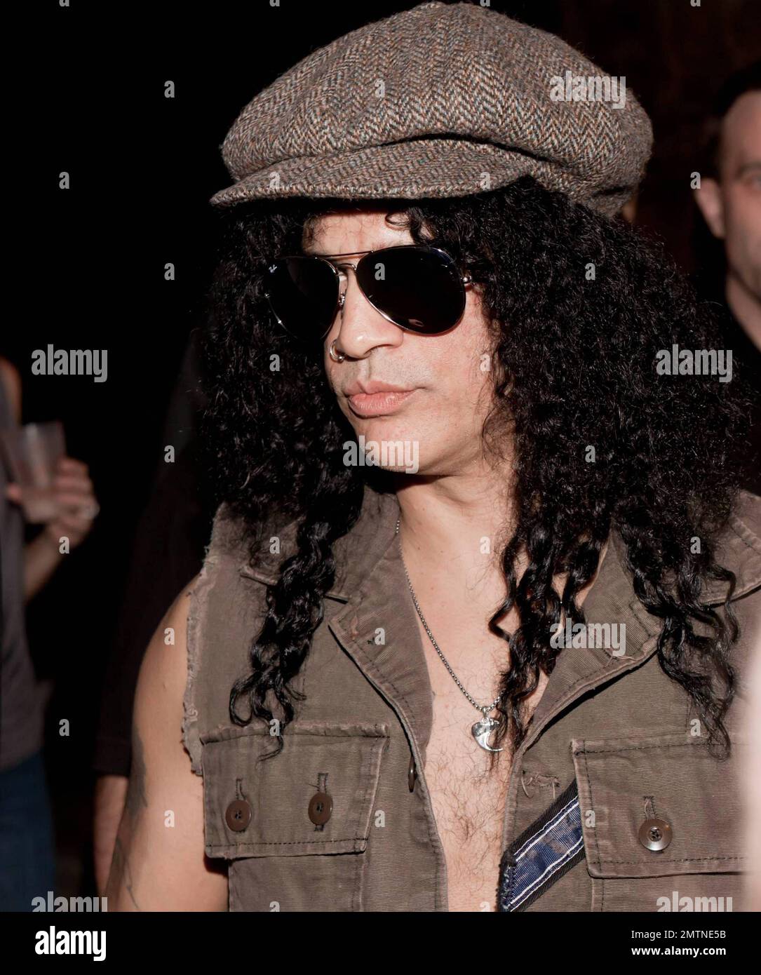 Legendary musician Slash (aka Saul Hudson) shows off his tattoos in a ...