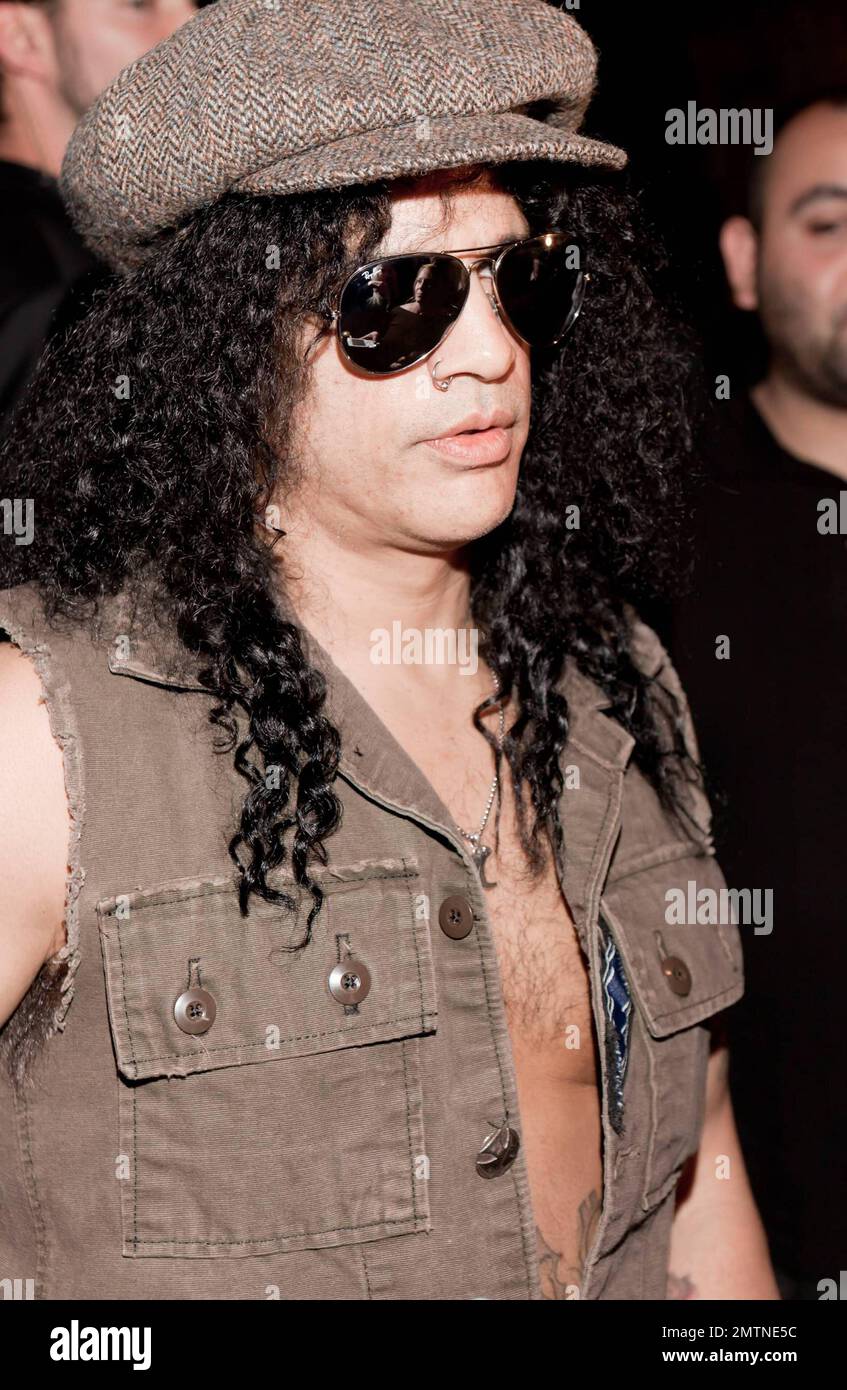 Legendary musician Slash (aka Saul Hudson) shows off his tattoos in a ...
