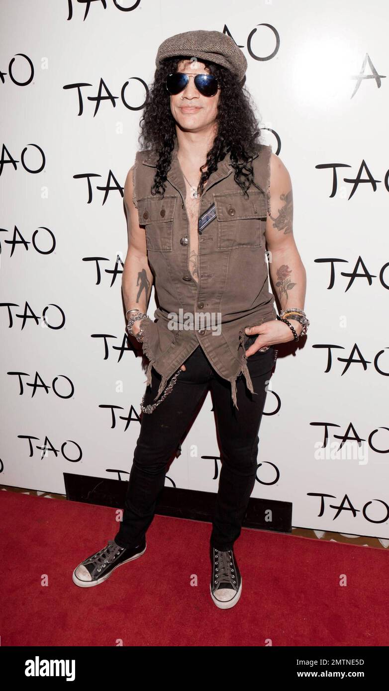 Legendary musician Slash (aka Saul Hudson) shows off his tattoos in a ...