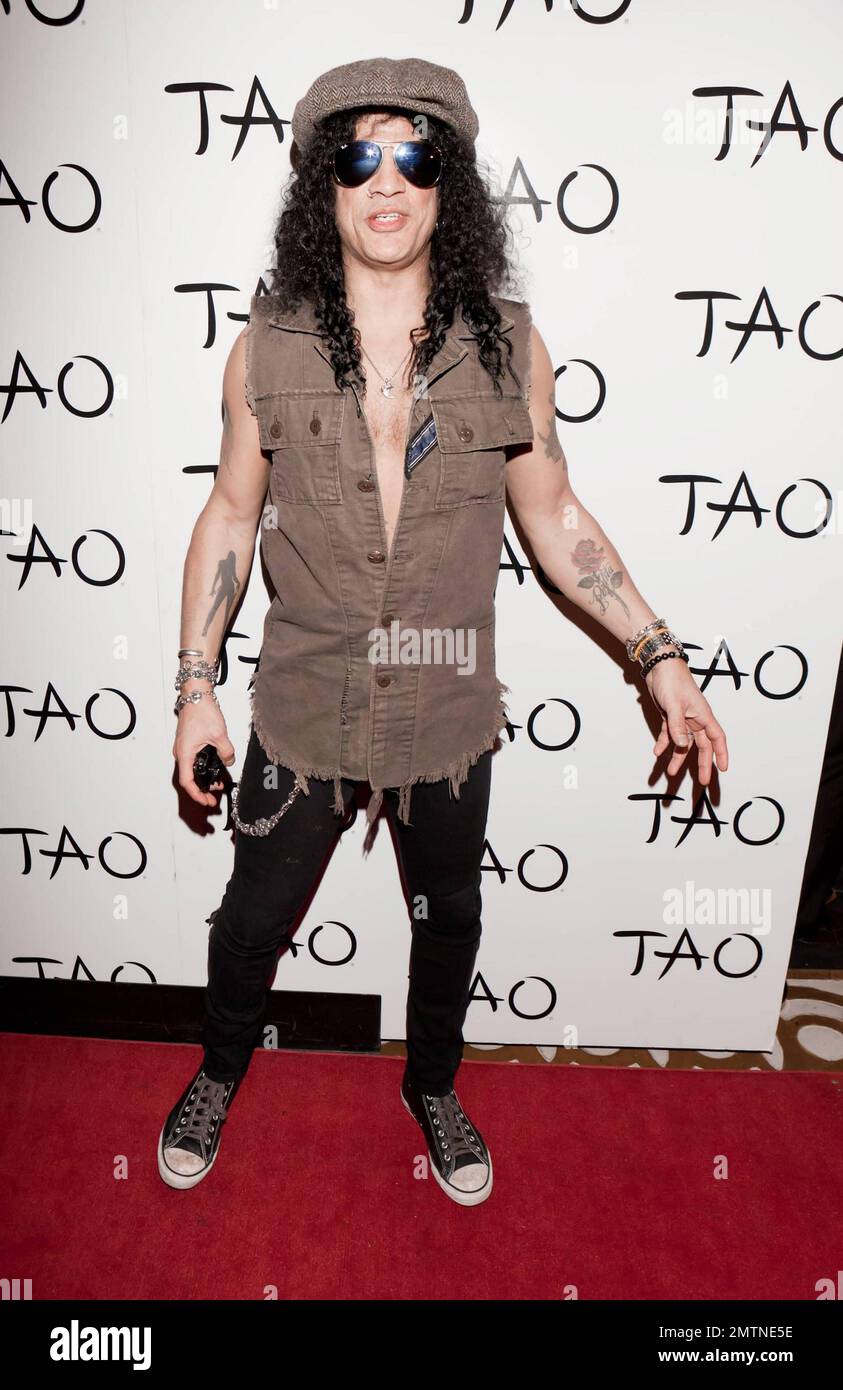 Legendary musician Slash (aka Saul Hudson) shows off his tattoos in a ...