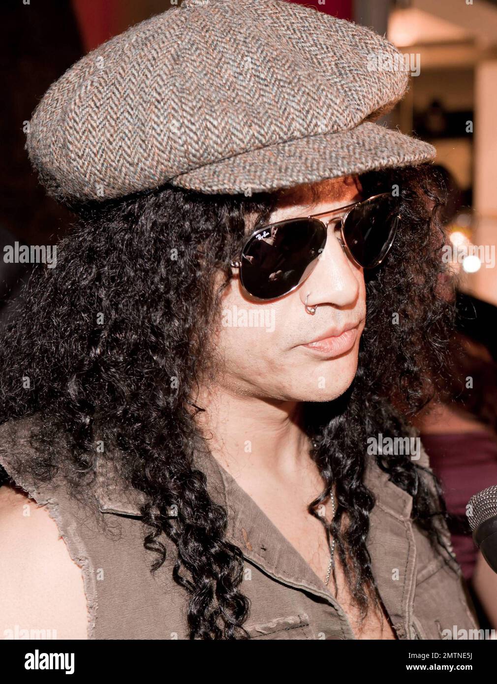 Legendary musician Slash (aka Saul Hudson) shows off his tattoos in a ...