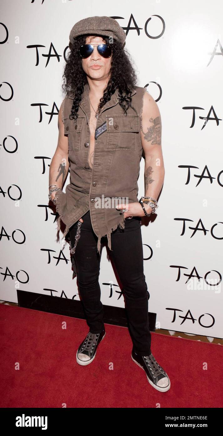 Legendary musician Slash (aka Saul Hudson) shows off his tattoos in a ...