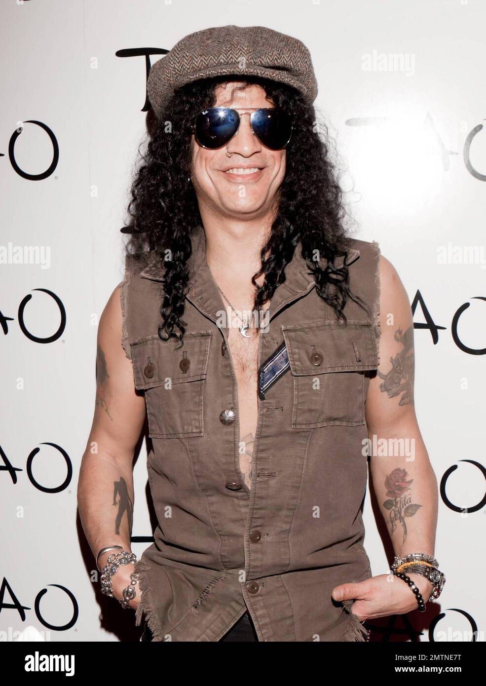 Legendary musician Slash (aka Saul Hudson) shows off his tattoos in a ...