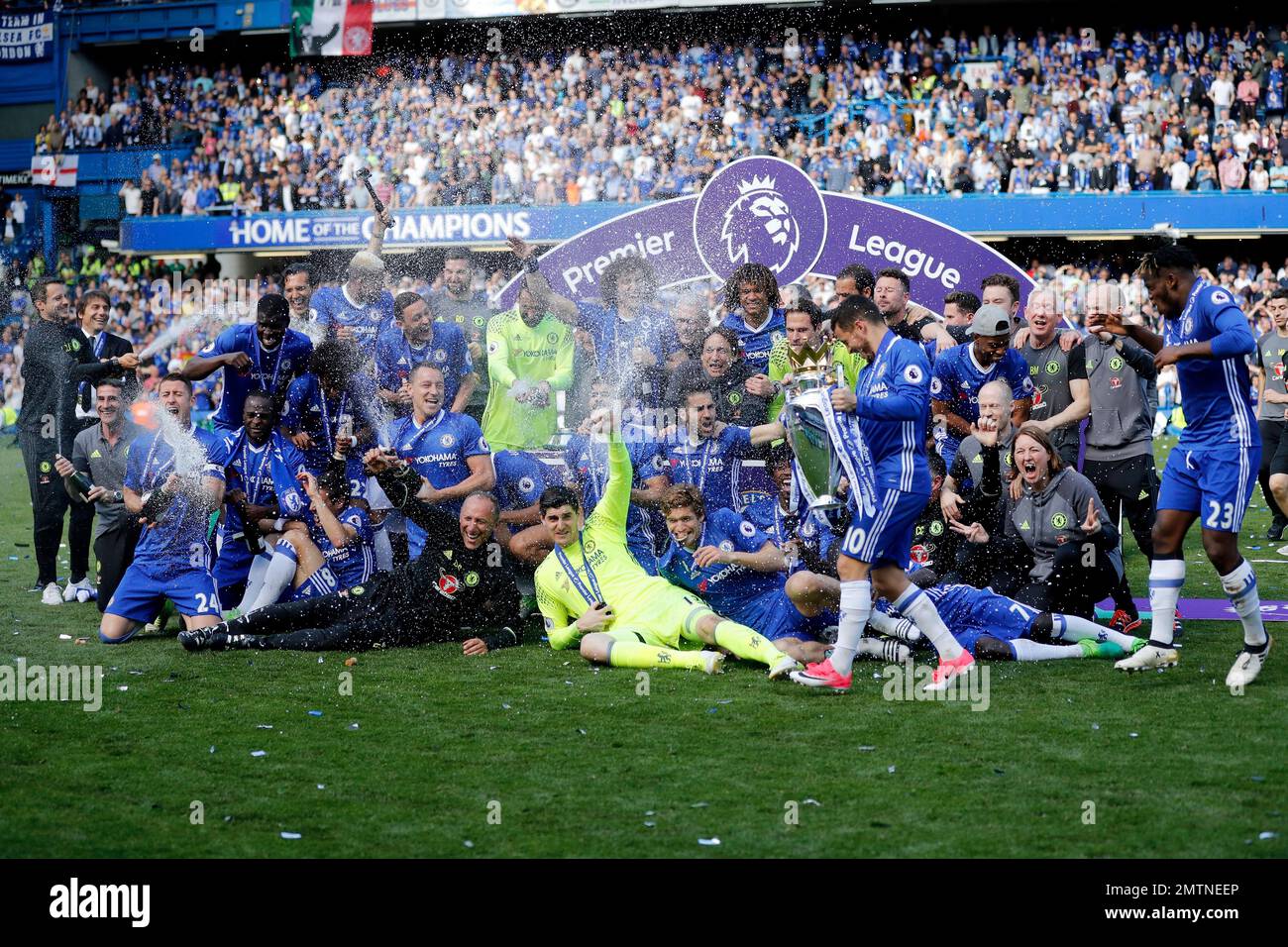 Chelsea's Eden Hazard carries the trophy to pose for a team photo after ...