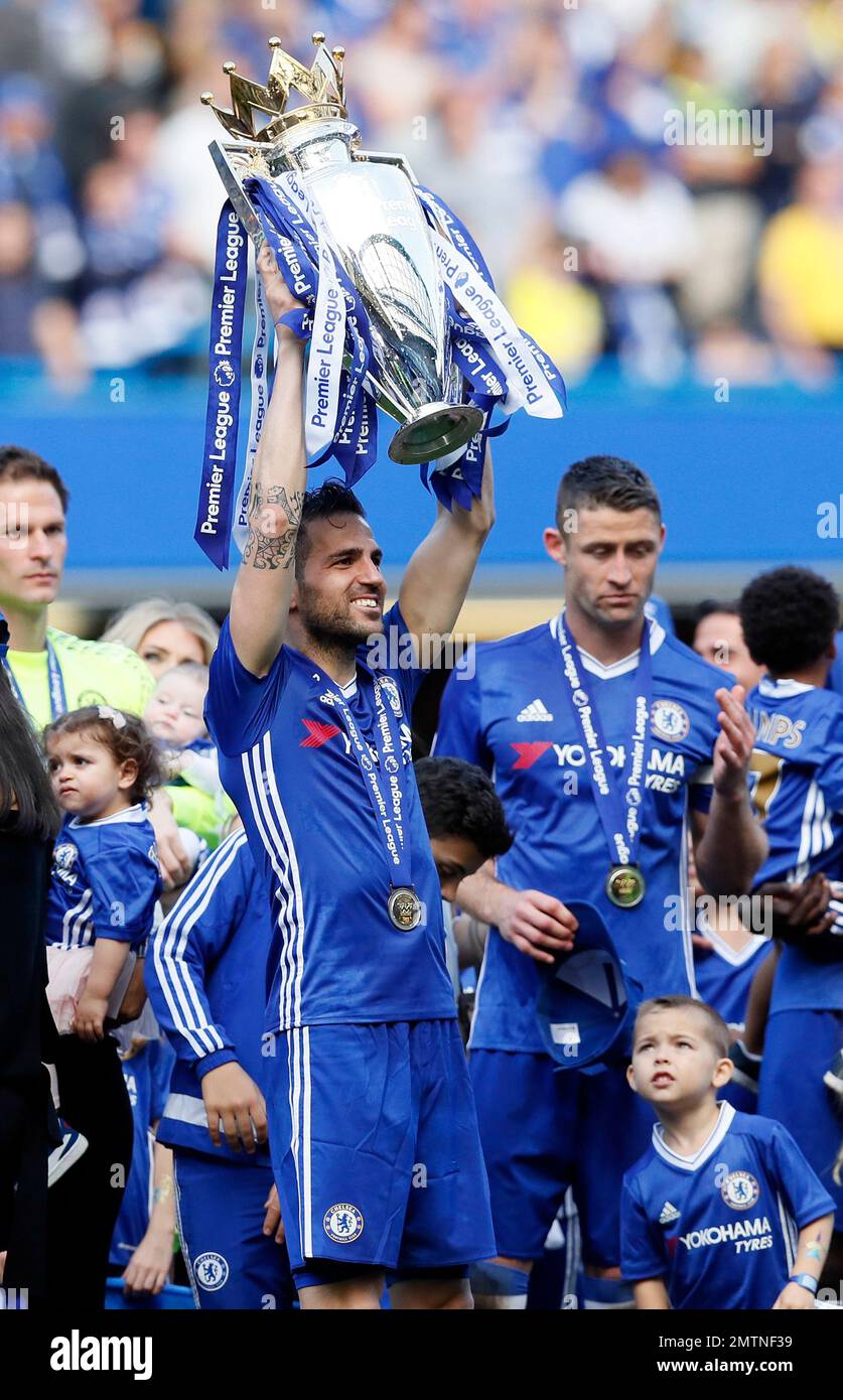 Chelsea's Pedro holds the English Premier trophy at the end of the ...