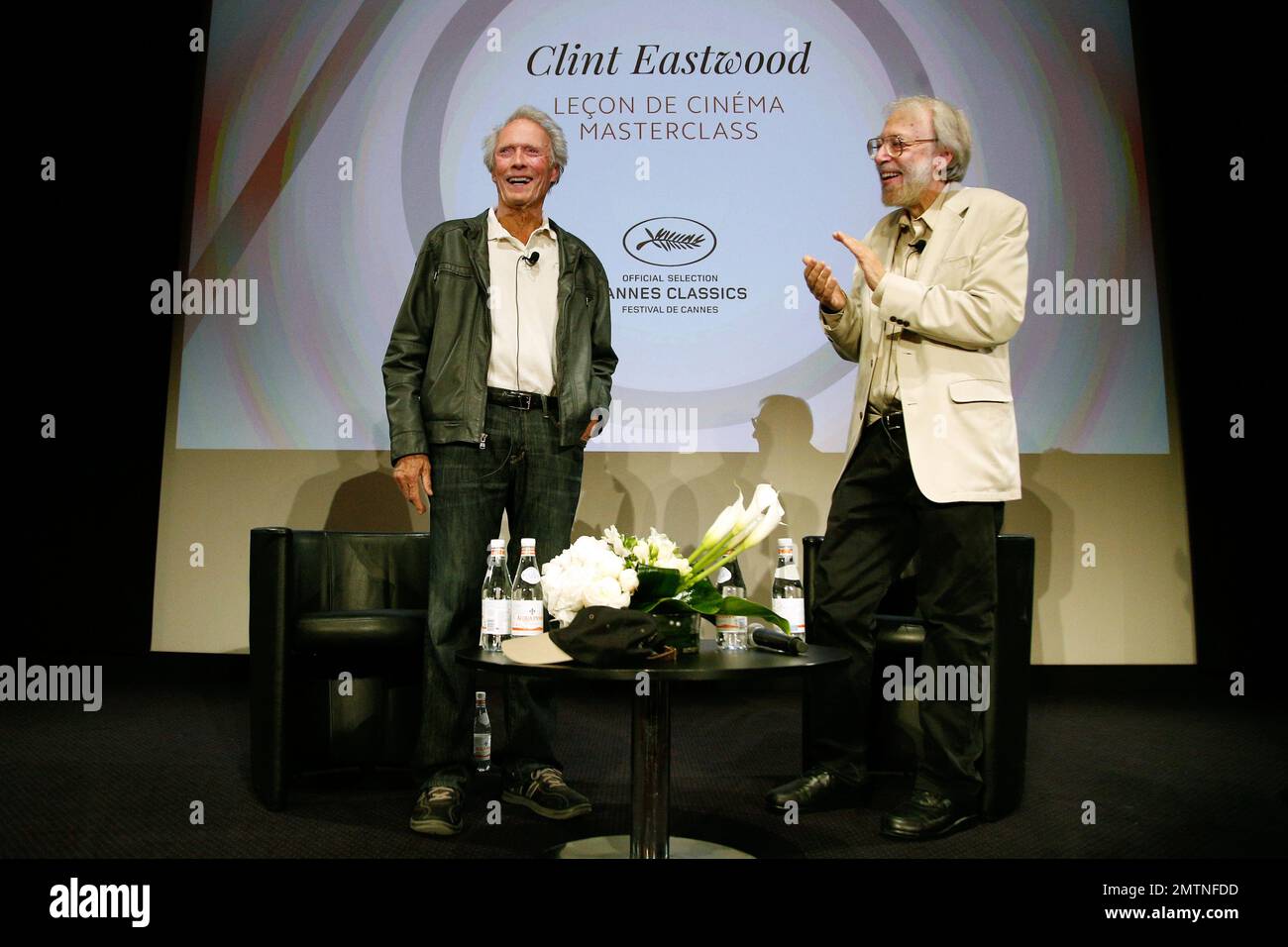 Director Clint Eastwood, left, acknowledges applause with film critic ...