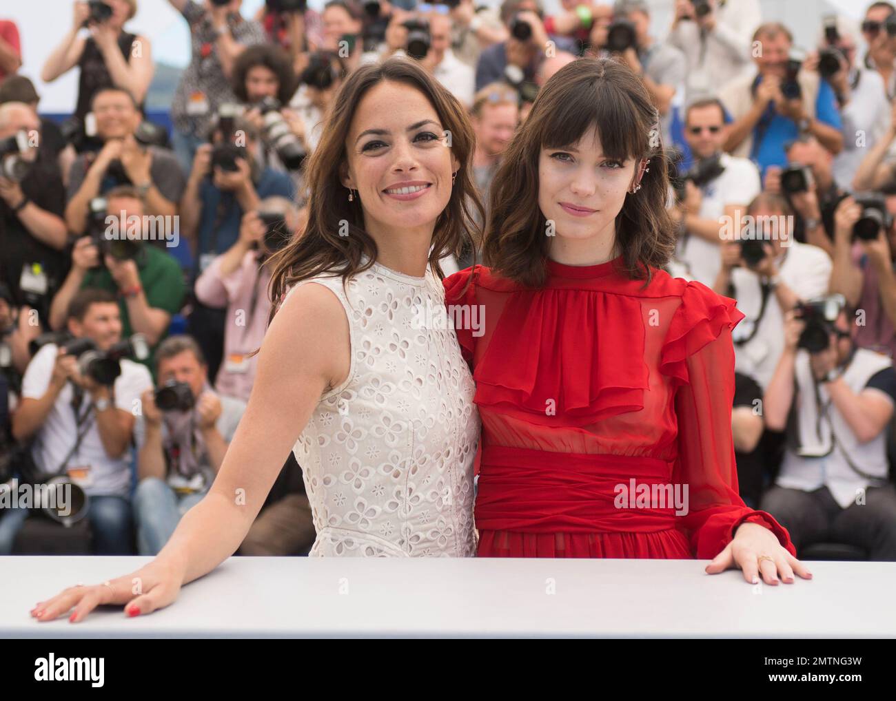 Berenice Bejo, left, and Stacy Martin pose for photographers during the ...