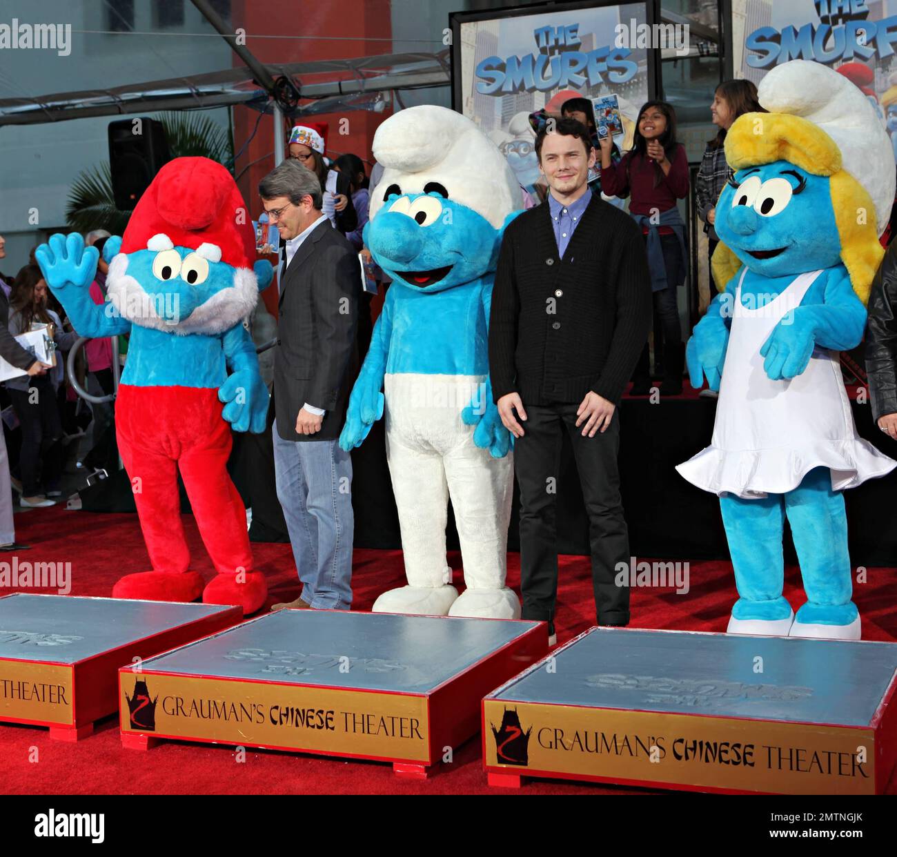 Papa Smurf, Bob Osher, Clumsy, Smurfette and Anton Yelchin at The ...
